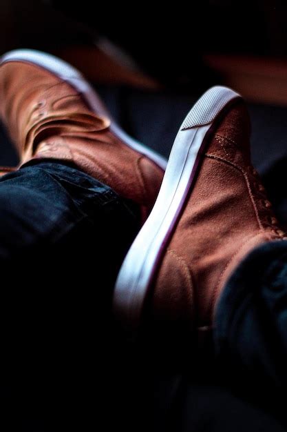 Premium Photo Low Section Of Boy Wearing Shoes