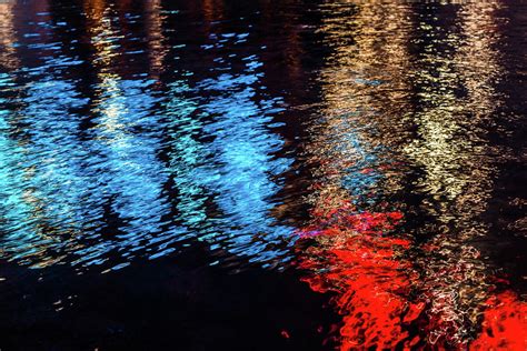 Colored Lights Reflected In Water Photograph By Jon Rapp Pixels