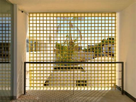 Yellow Grates Filter Light Into Apartments By Laurent Troost Architectures