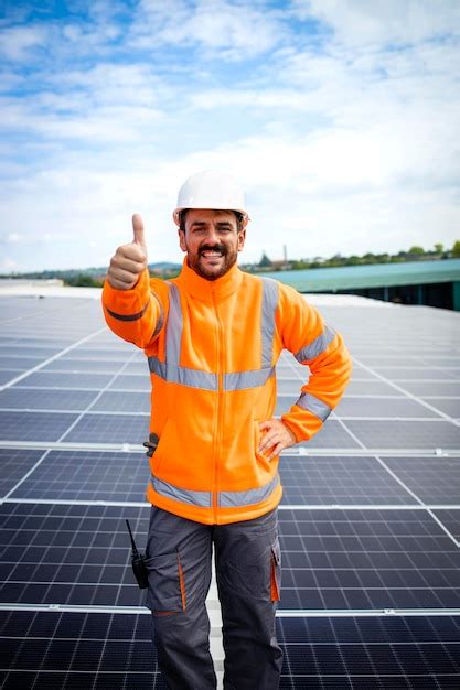 Premium Photo Installation Of Solar Panels And Professional Worker Holding Thumbs Up