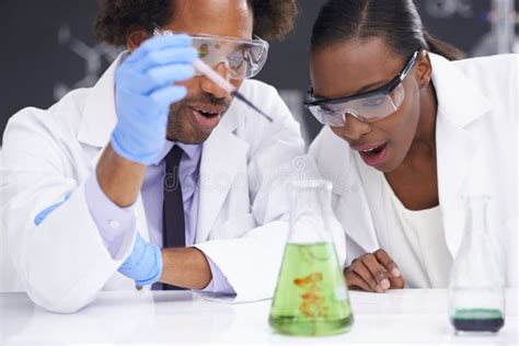 Exciting Stuff Man Two Scientists Conducting An Experiment With
