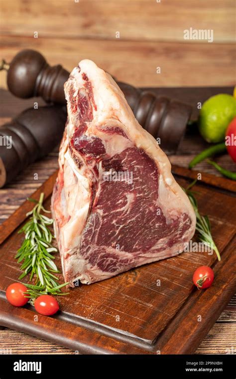 Large Raw Beef T Bone Steak Veal Cowboy Steak On Rib Eye Wood