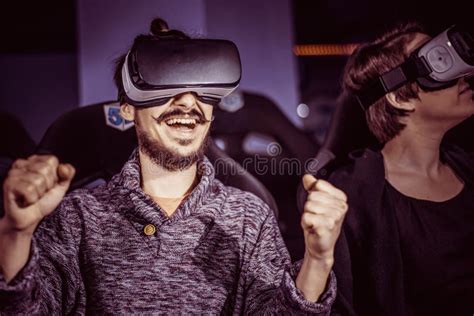 A Couple Having Fun At The Cinema In Virtual Glasses With Special