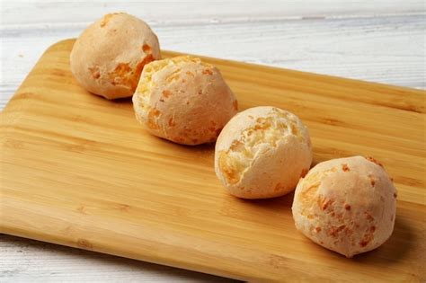 Premium Photo Small Cheese Bread Buns On Wooden Board On Table