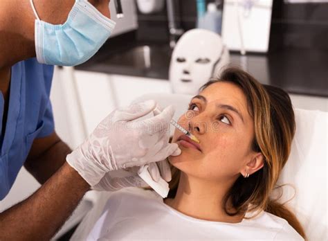 Woman Getting Injection For Facial Correction In Cosmetology Clinic