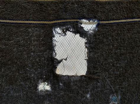Worn Fabric With Noticeable Tear And Frayed Edges Stock Image Image