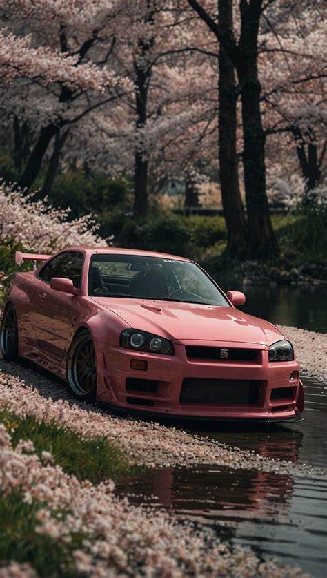A Nissan Gtr On A Pristine Lake Surrounded By Cherry Blossoms Nissan