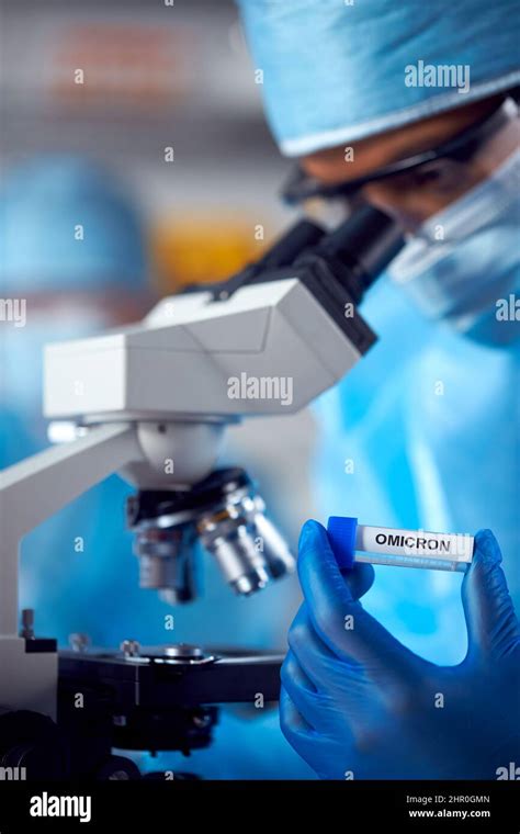 Close Up Of Female Lab Worker Wearing Ppe Researching Omicron Variant