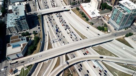 Overhead Drone Footage Of Cars Driving Over Elevated Highway And Busy