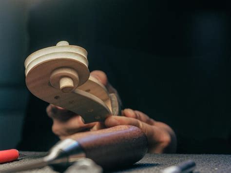 Premium Photo Luthier Working A Classic Violin Scroll