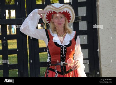 Woman Dressed In Medieval Costume Salutes At The Renaissance Festival