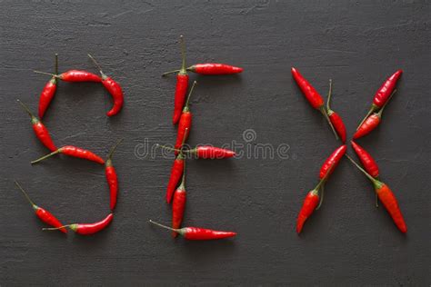 Word Sex Red Hot Chili Peppers On Black Background On Black Table Swx