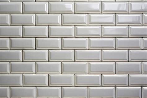 White Ceramic Subway Tiles With Beveled Edges In A Brick Pattern And