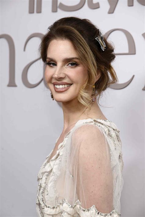 Lana Del Rey Kicked Off Coquette Fall In A Princess Updo And Butterfly Clip