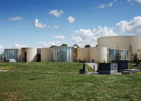 Plan 01s Crematorium Is Covered In Ribbed Concrete And Glass