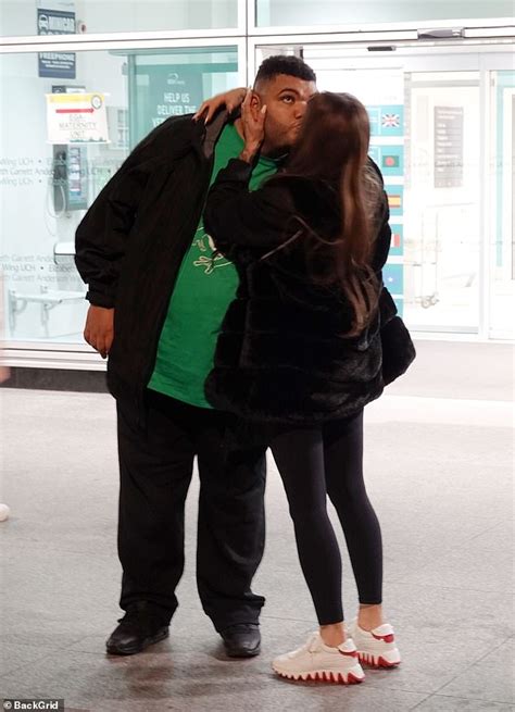 Katie Price Plants A Kiss On Her Son Harvey While They Attend An