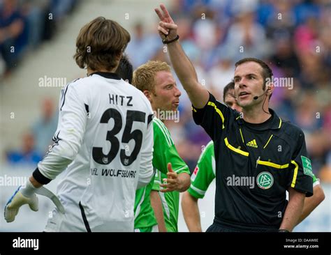 Referee Marco Fritz R Sends Wolfsburgs Goalie Marwin Hitz L Off The Pitch During German