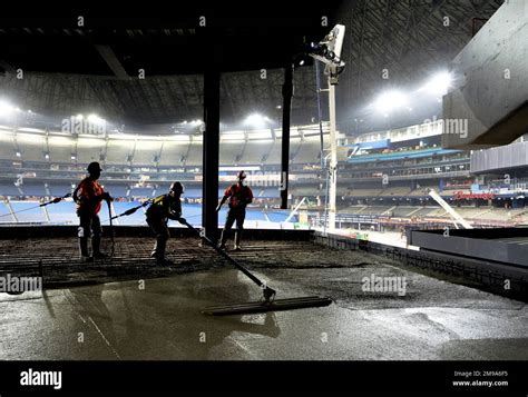 Workers Float New Concrete During The Rogers Centre Renovation In