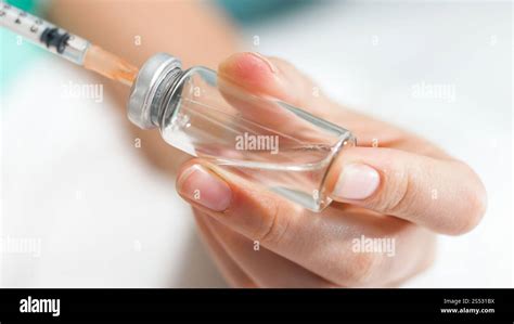 Macro Photo Of Nurse Preparing Medication In Glass Ampule Macro Image