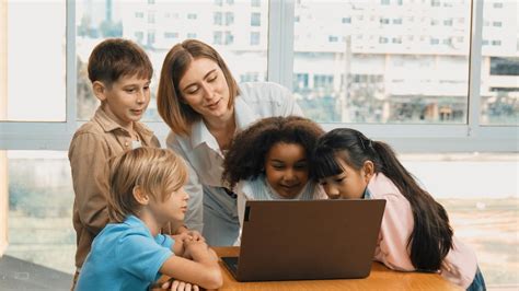 Premium Photo Cute Girl Programing System While Surround With Teacher