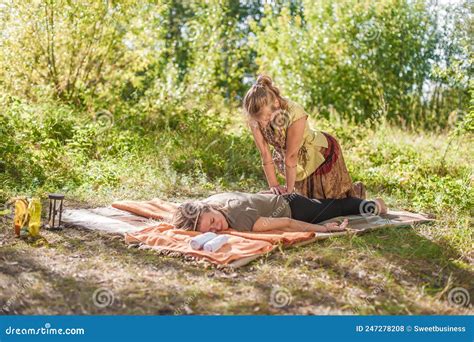 Massage Trainer Demonstrates Refreshing Massaging Methods In A Forest