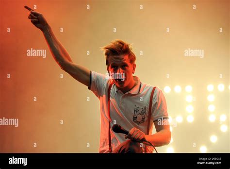 Singer Felix Brummer Of The German Band Kraftklub Performs On Stage At The Veltins Arena In