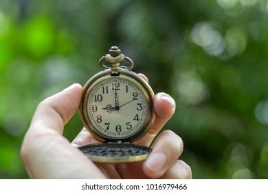 Woman Holding Pocket Watch Over 747 Royalty Free Licensable Stock
