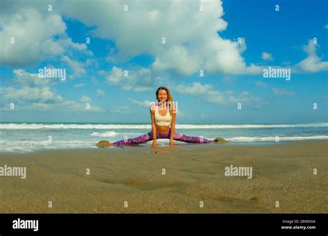 Woman Practicing Yoga At Beautiful Beach Young Happy And Attractive