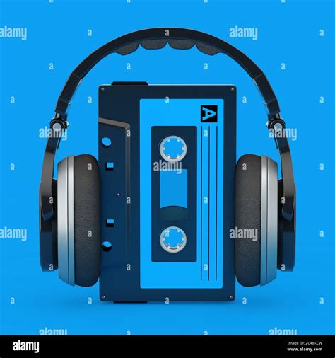 Headphones Over Old Vintage Audio Cassette Tape On A Blue Background