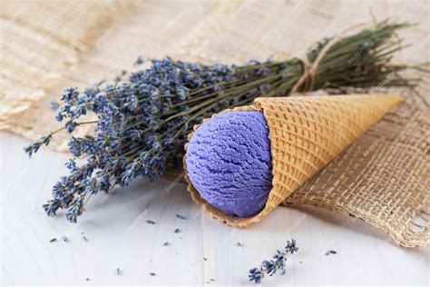 Premium Photo Lavender Ice Cream In A Waffle Cone On A Light Background