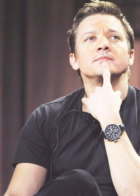 Jeremy Looking Off Into The Distance With Index Finger From His Left