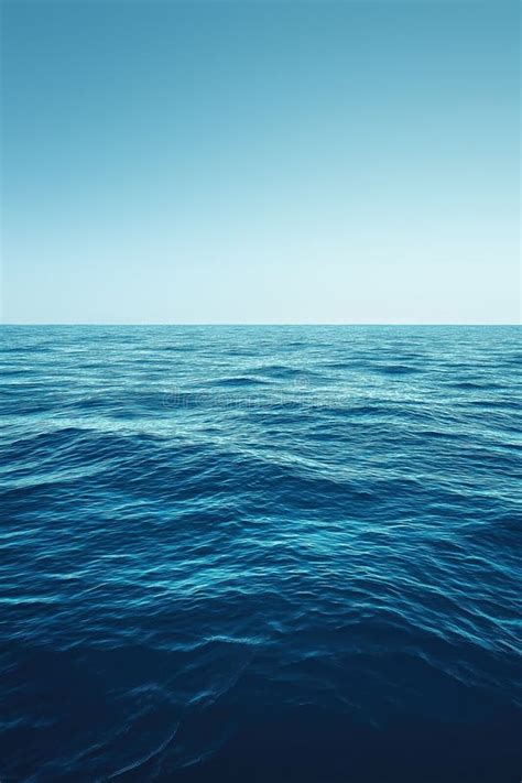 Deep Blue Ocean Waves Under A Clear Sky Meeting At The Horizon Stock