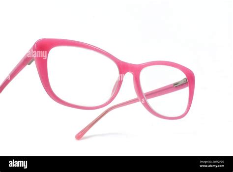 Close Up View Of A Pair Of Glasses With Pink Plastic Frames Isolated On