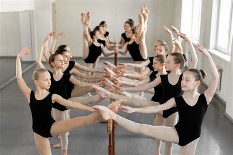 Group Of Ballerinas Training At Ballet Barre Young Ballet Girls In