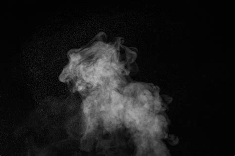 Premium Photo Vapor Steam Rising Over Black Background Splashes And Drops Of Water Curly White