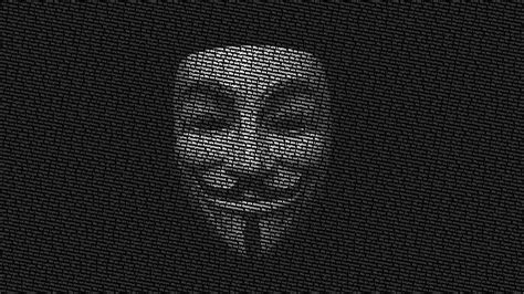 Download Anonymous Mask On Black Tablet Wallpaper