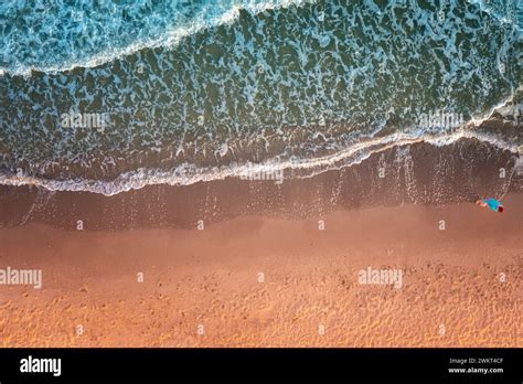 top view of the surf lie waves and sandy beach artistic red green