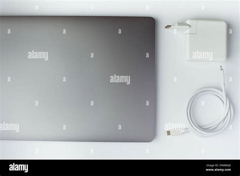 Close Up Photo Of Charger White Cable And Laptop Stock Photo Alamy