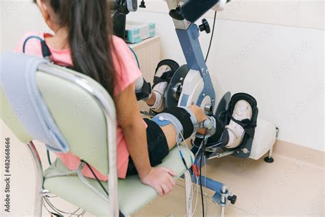 Patient On Continuous Passive Range Of Motion Machines Device To Provide Anatomically Correct