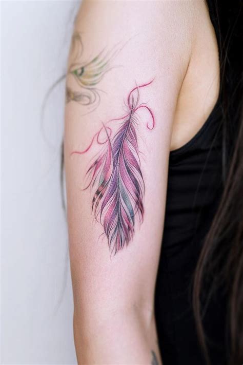 Feather Tattoo With Birds Flying Out On Back