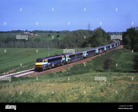 One Anglia Liveried Class 90 And Mk3 Coaches Near Brantham On 18th May