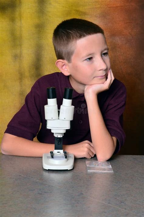 Young Boy Using A Microscope Stock Image Image Of Analyzing