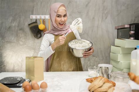 Young Beautiful Muslim Woman Is Baking In Her Kitchen Bakery And