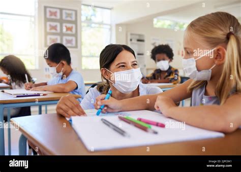 Covid Education And Learning With A Teacher Helping A Student During