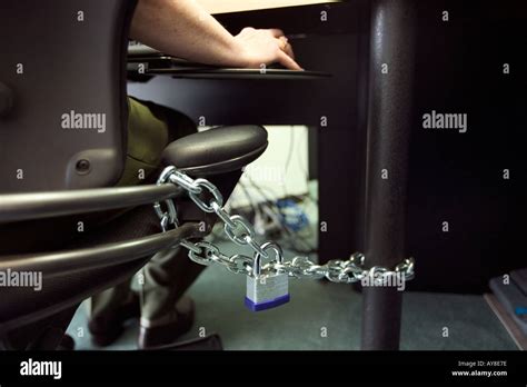 Office Employee Executive Is Chained To Desk And Chair Stock Photo Alamy