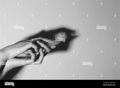 Shadow Puppet Woman Making Hand Gesture Like Crocodile On Light