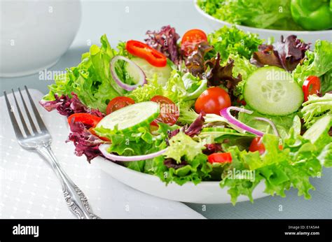 A Mixed Salad With Lettuce Cucumber Tomatoes Red Pepperm And Red