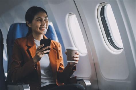 Premium Photo Traveling And Technology Flying At First Class Pretty
