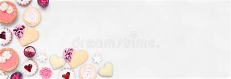 Mothers Day Or Love Themed Baking Corner Border With A Variety Of Cookies And Sweets On A White