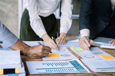 Businessmen Team Or Financial Data Analysts Working With Tablets And